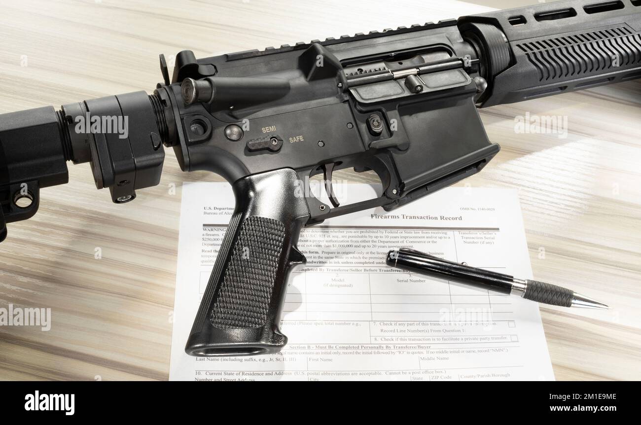 AR-15 and public domain FBI NICS check form with a pen Stock Photo - Alamy