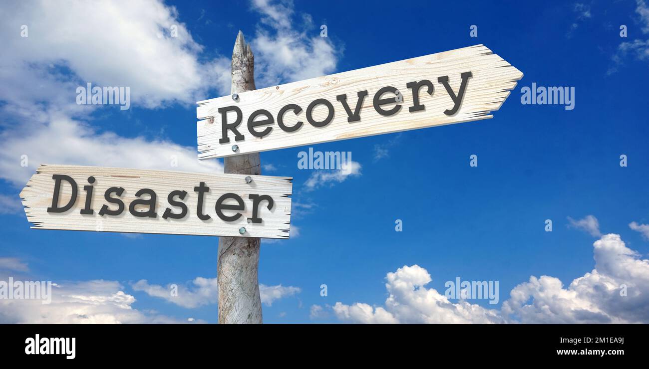 Recovery, disaster - wooden signpost with two arrows Stock Photo - Alamy