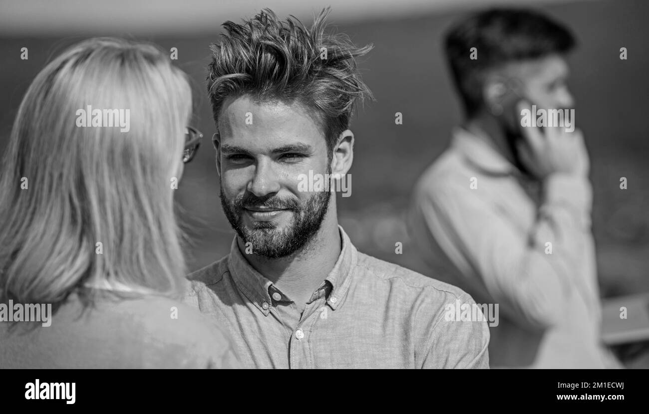 Couple having fun while busy businessman speak on phone. Partners glad ...