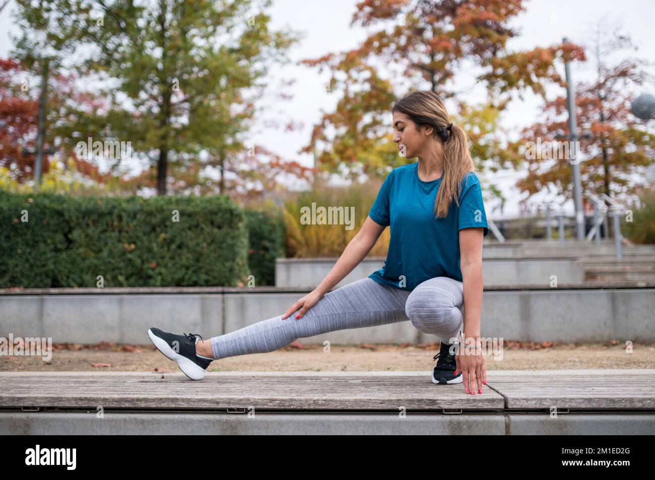 Female runner in Stratford Olympic Park, East London, England, UK Stock ...