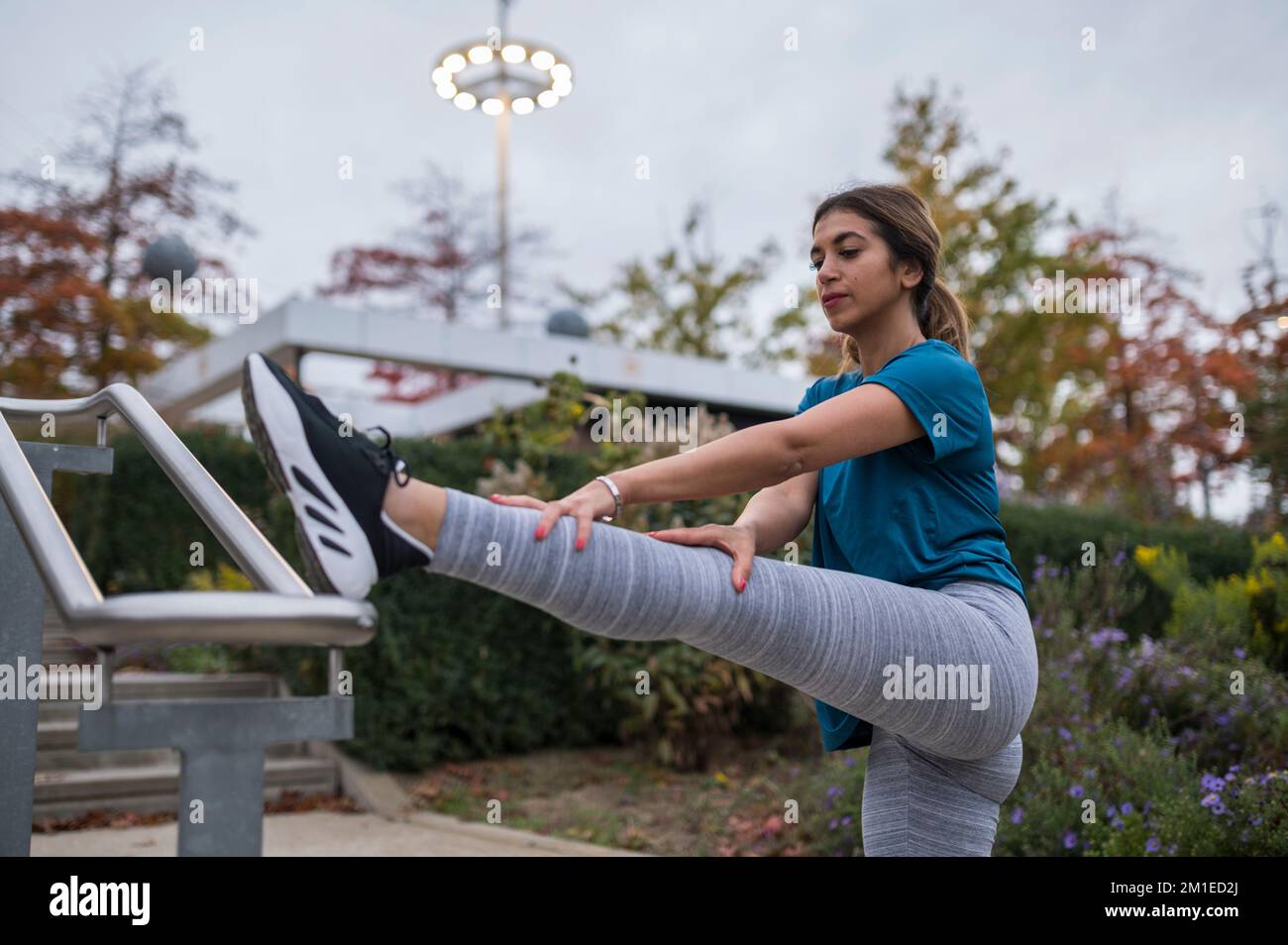 Female runner in Stratford Olympic Park, East London, England, UK Stock ...