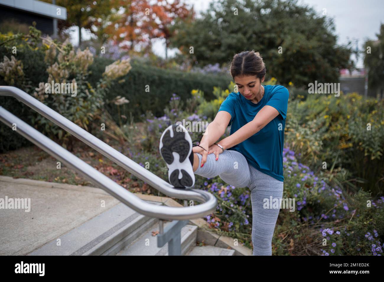 Female runner in Stratford Olympic Park, East London, England, UK Stock ...