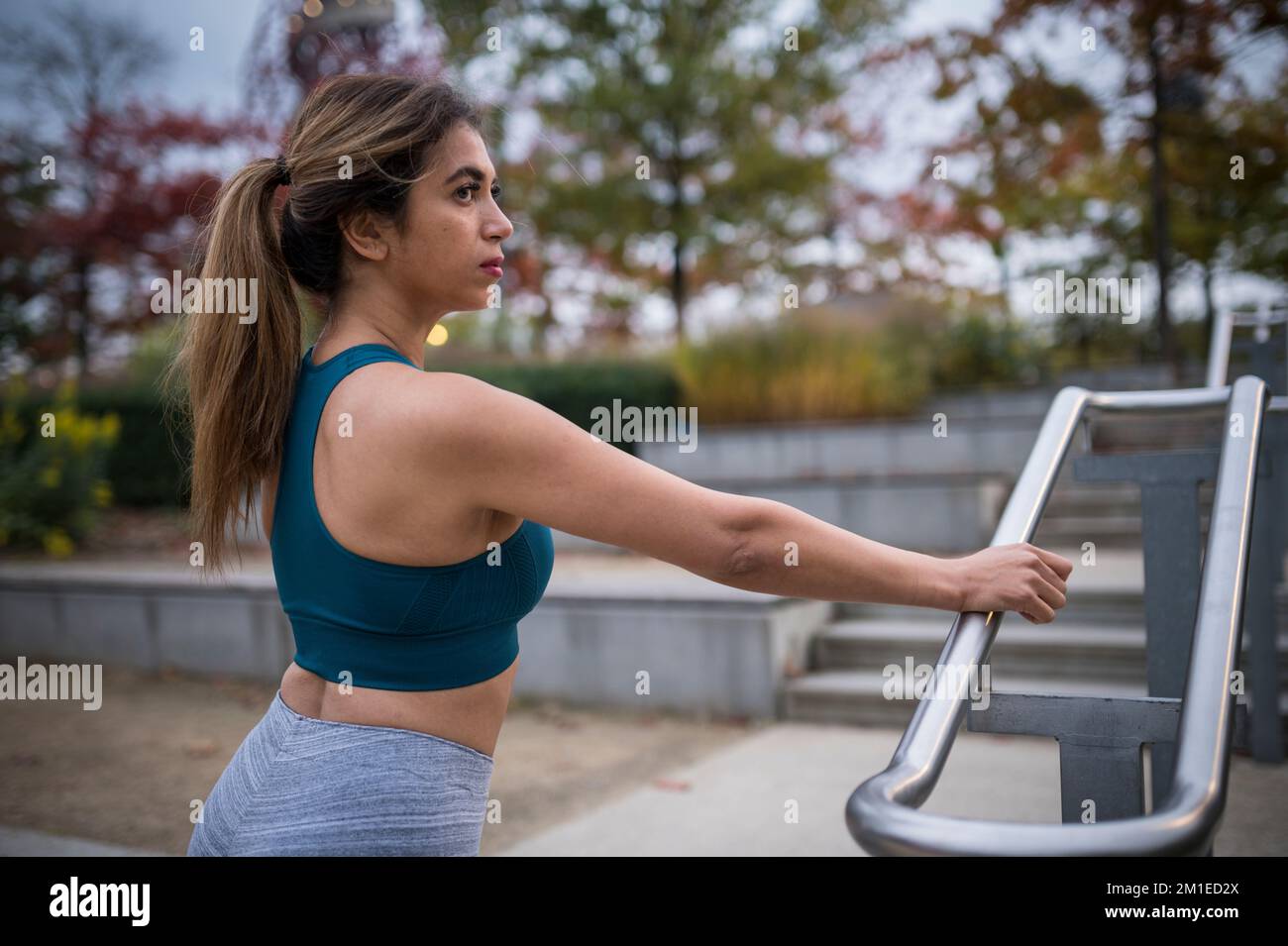 Female runner in Stratford Olympic Park, East London, England, UK Stock ...