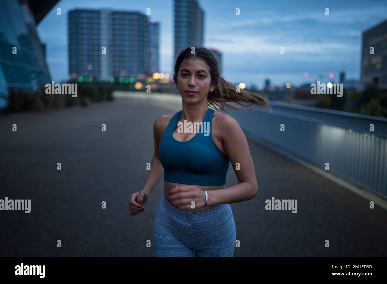Female runner in Stratford Olympic Park, East London, England, UK Stock ...