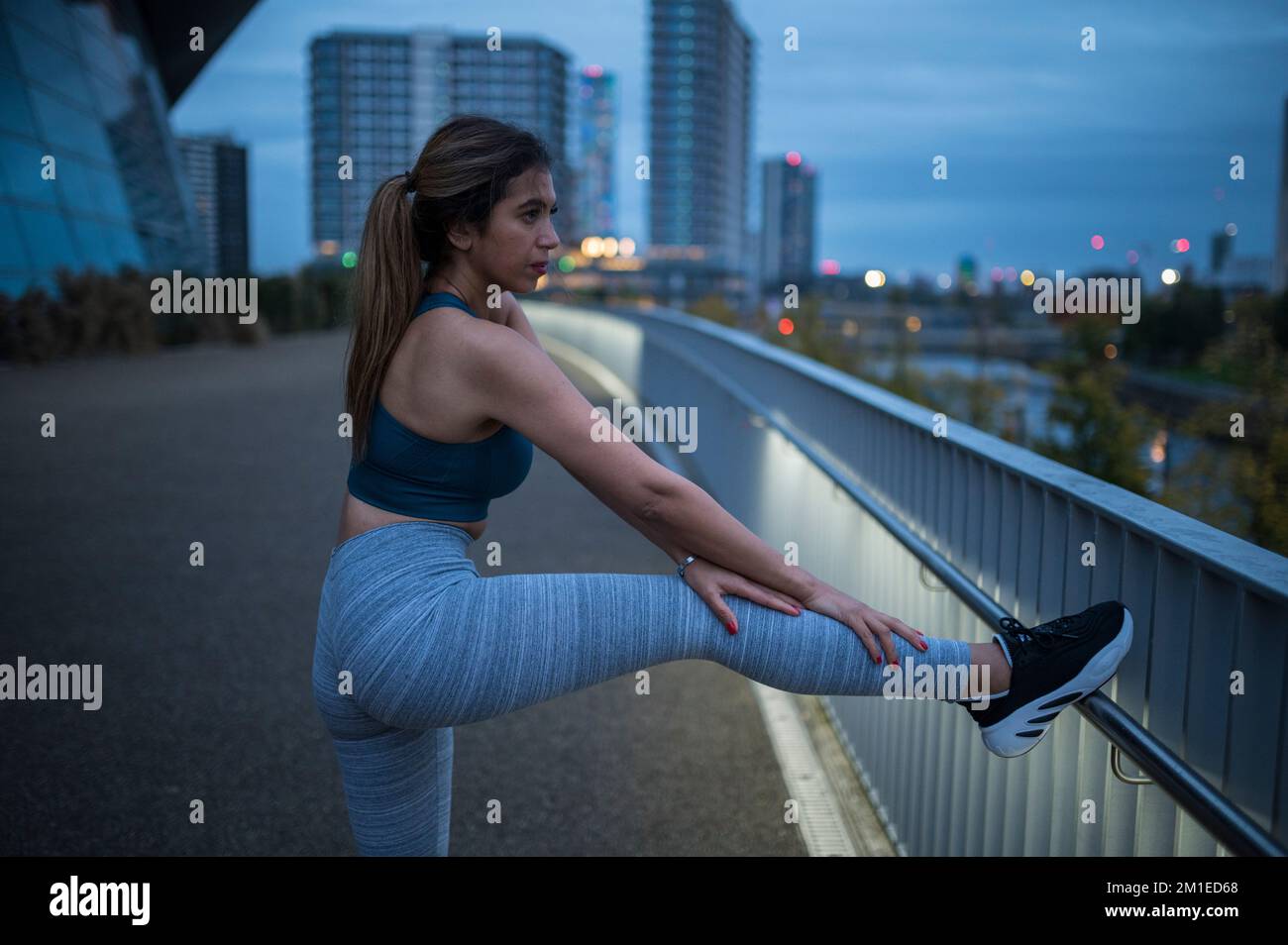 Female runner in Stratford Olympic Park, East London, England, UK Stock ...