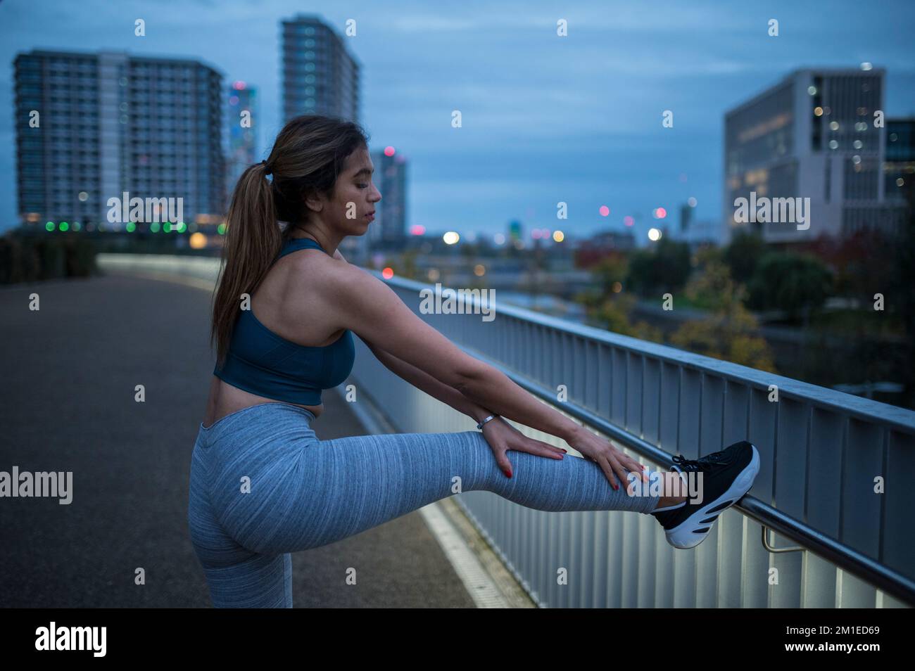 Female runner in Stratford Olympic Park, East London, England, UK Stock ...
