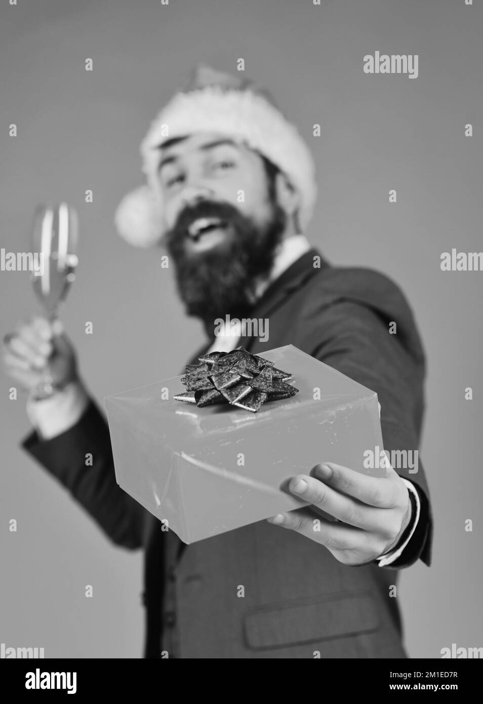 Businessman with cheerful face holds present box in close up Stock ...