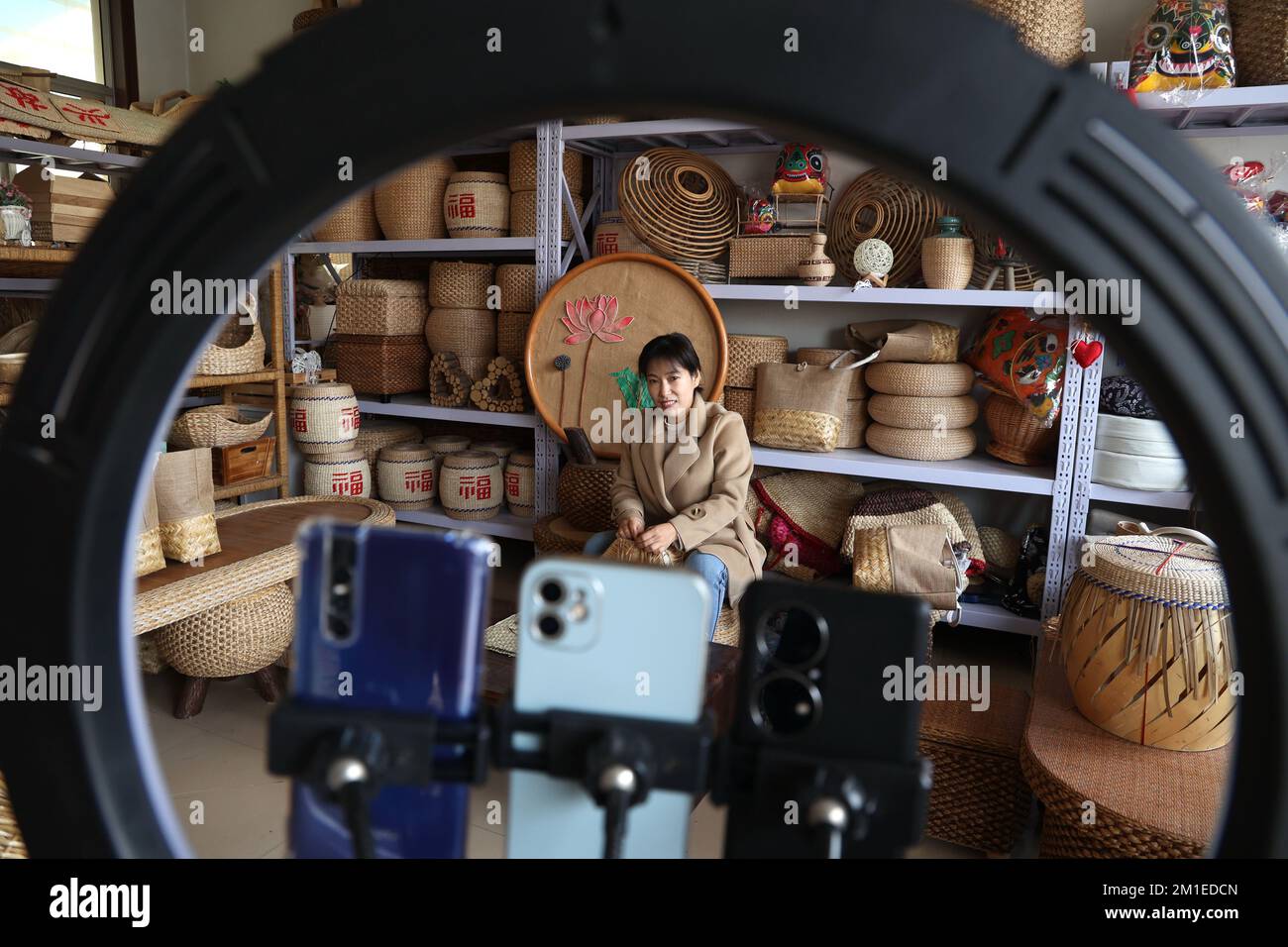 BINZHOU, CHINA - DECEMBER 12, 2022 - Craftsman Wang Guizhi sells straw ...