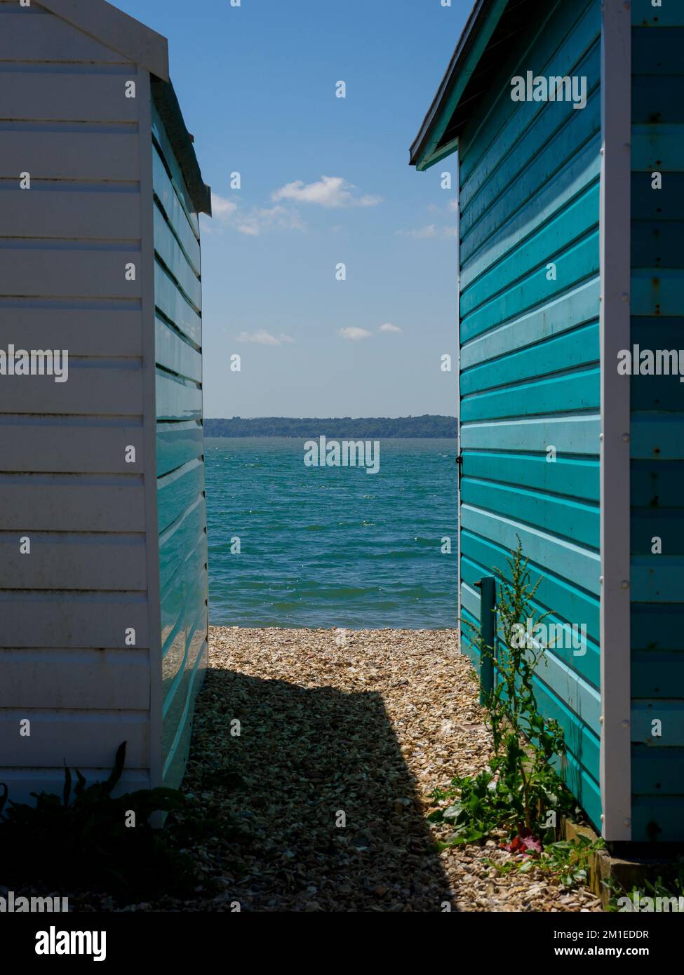 Looking between beach huts to the sea, Lee-on-the-Solent, Hampshire, UK ...