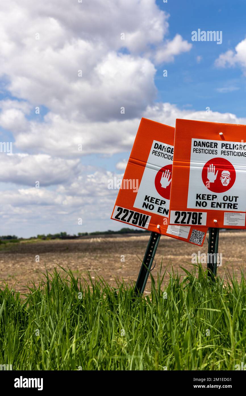 Warning signs next to field in rural Illinois Stock Photo - Alamy
