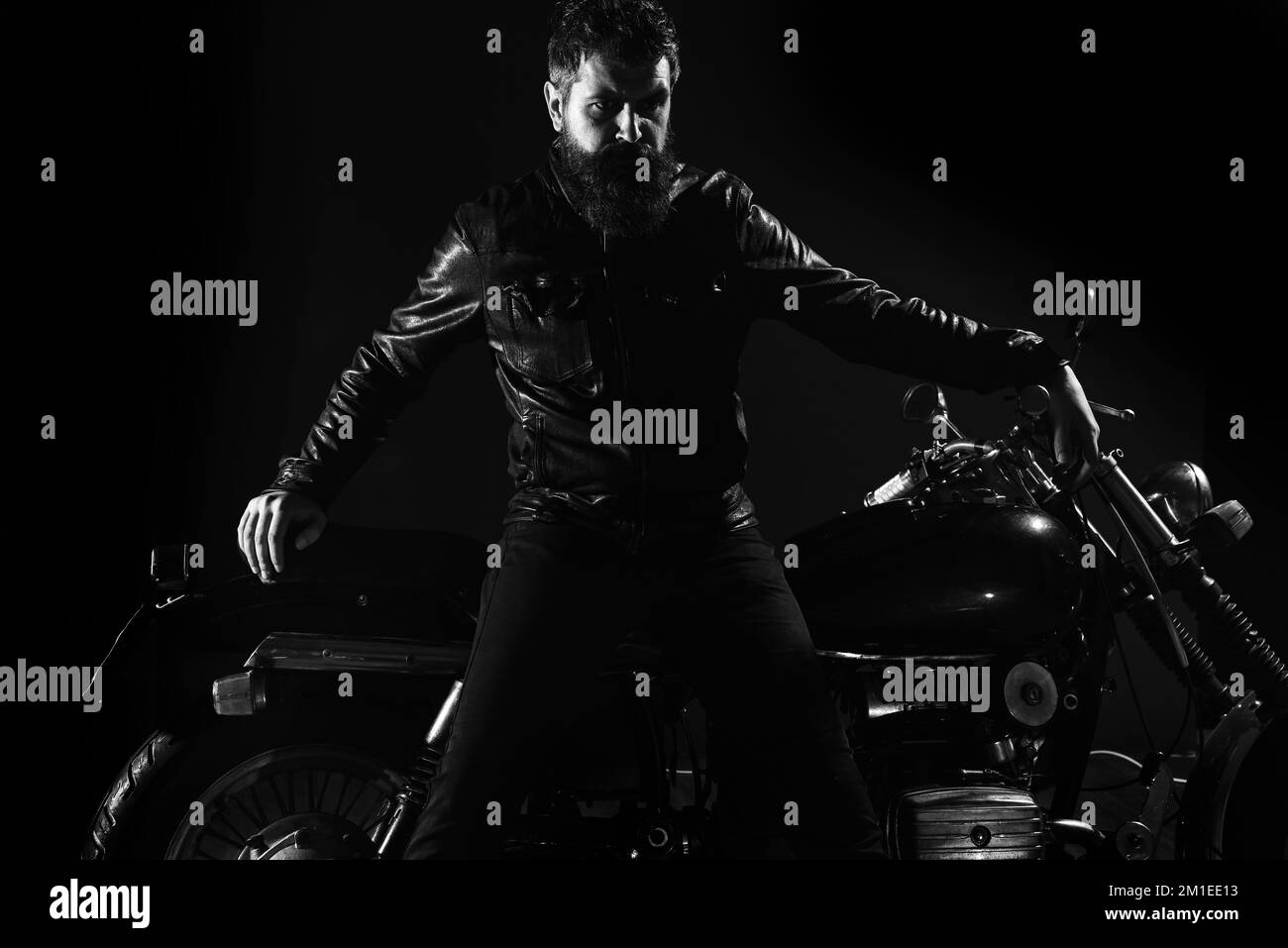 Bearded biker on motorcycle Black and White Stock Photos & Images - Alamy