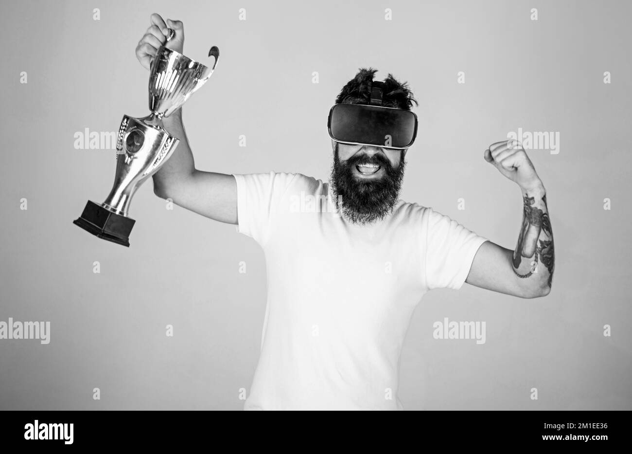 Hipster on happy face squeezing fist as successful gesture. Guy with ...