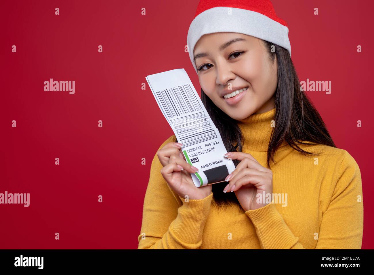 Cute smiling woman holding a barcode in hands Stock Photo - Alamy