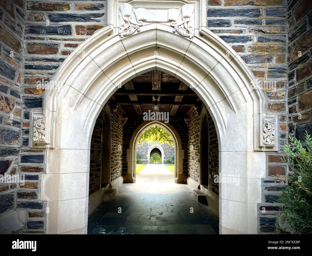 Open passage in an arched and aligned stone building. the Building ...
