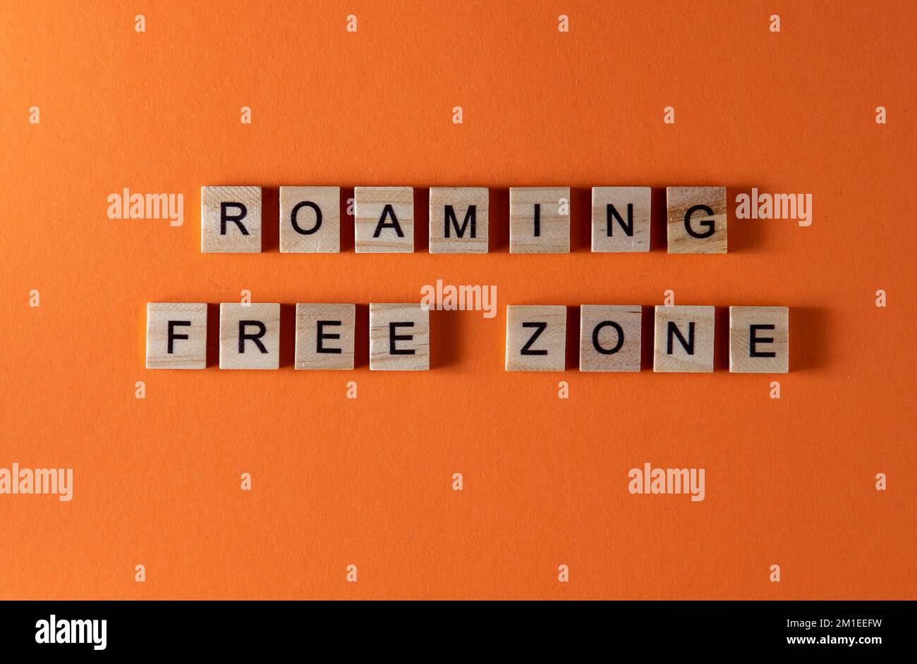Roaming free zone word phrase in wooden letters. Motivation and slogan ...