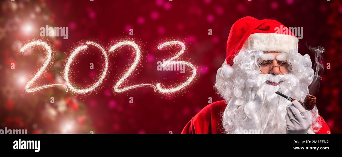 Santa Claus smoking a tobacco pipe, relax after work concept Stock ...