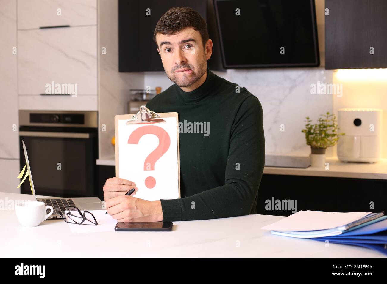 Confused worker during home office hours Stock Photo - Alamy