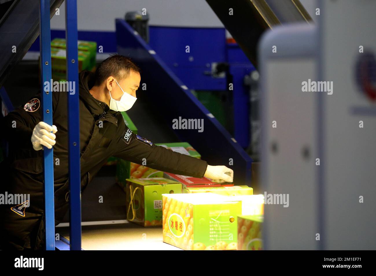 CHENZHOU, CHINA - DECEMBER 12, 2022 - Staff members sort express ...