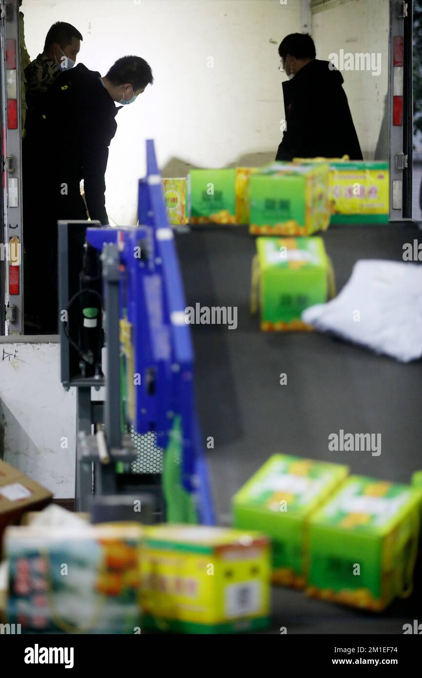 CHENZHOU, CHINA - DECEMBER 12, 2022 - Staff members sort express ...