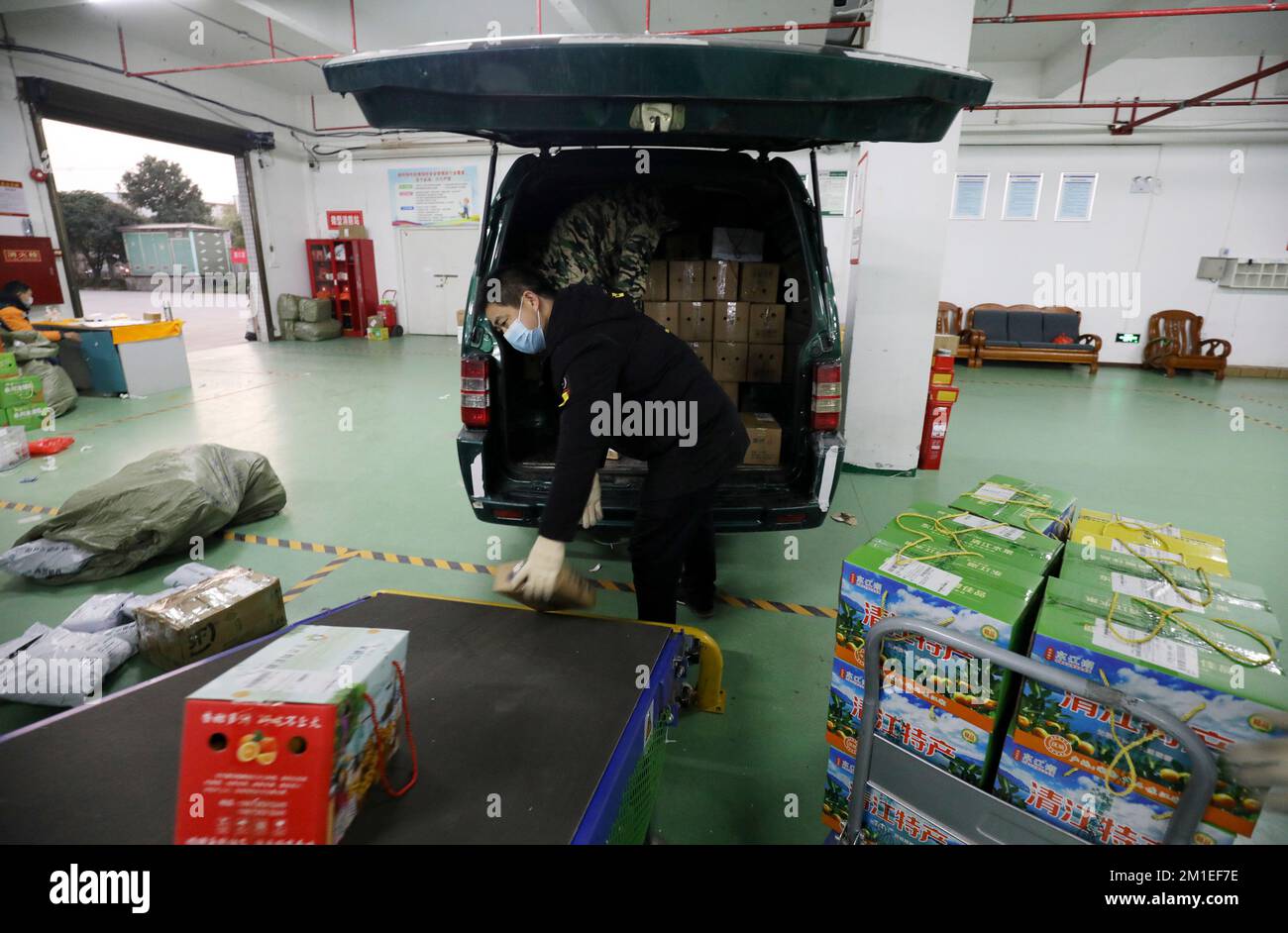 CHENZHOU, CHINA - DECEMBER 12, 2022 - Staff members sort express ...