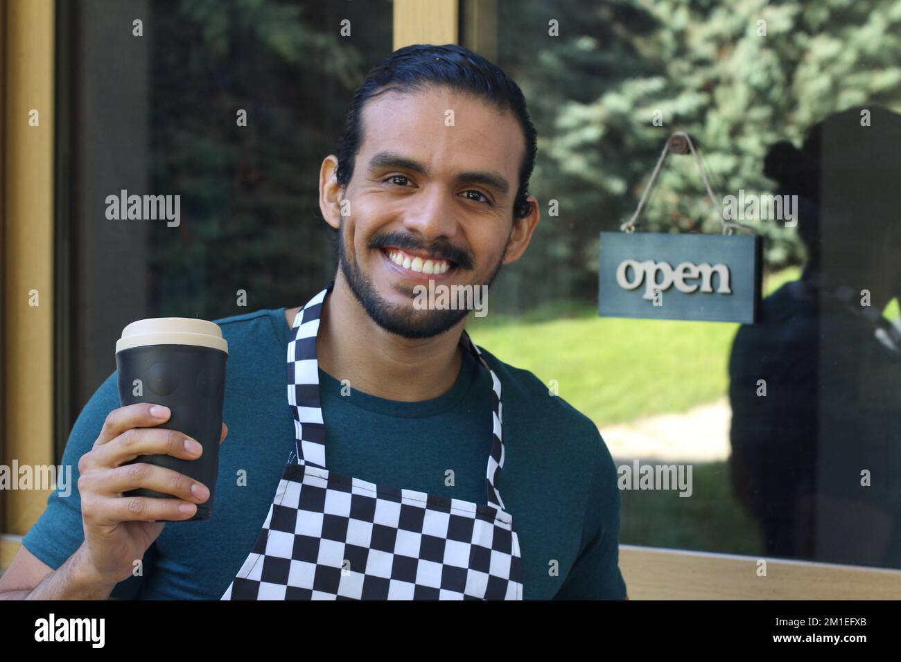 Cafe owner standing in entrance hi-res stock photography and images - Alamy