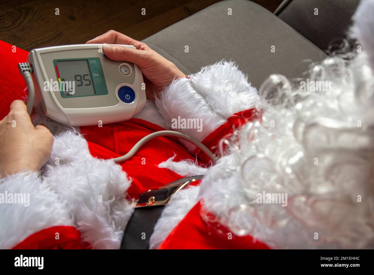 Santa is sick and not feeling well. Santa measures blood pressure Stock ...