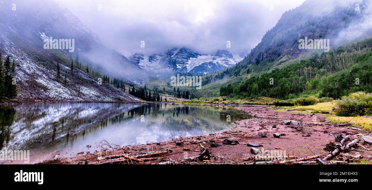 A panoramic view of the scenic landscape of Maroon Bells with mountains ...