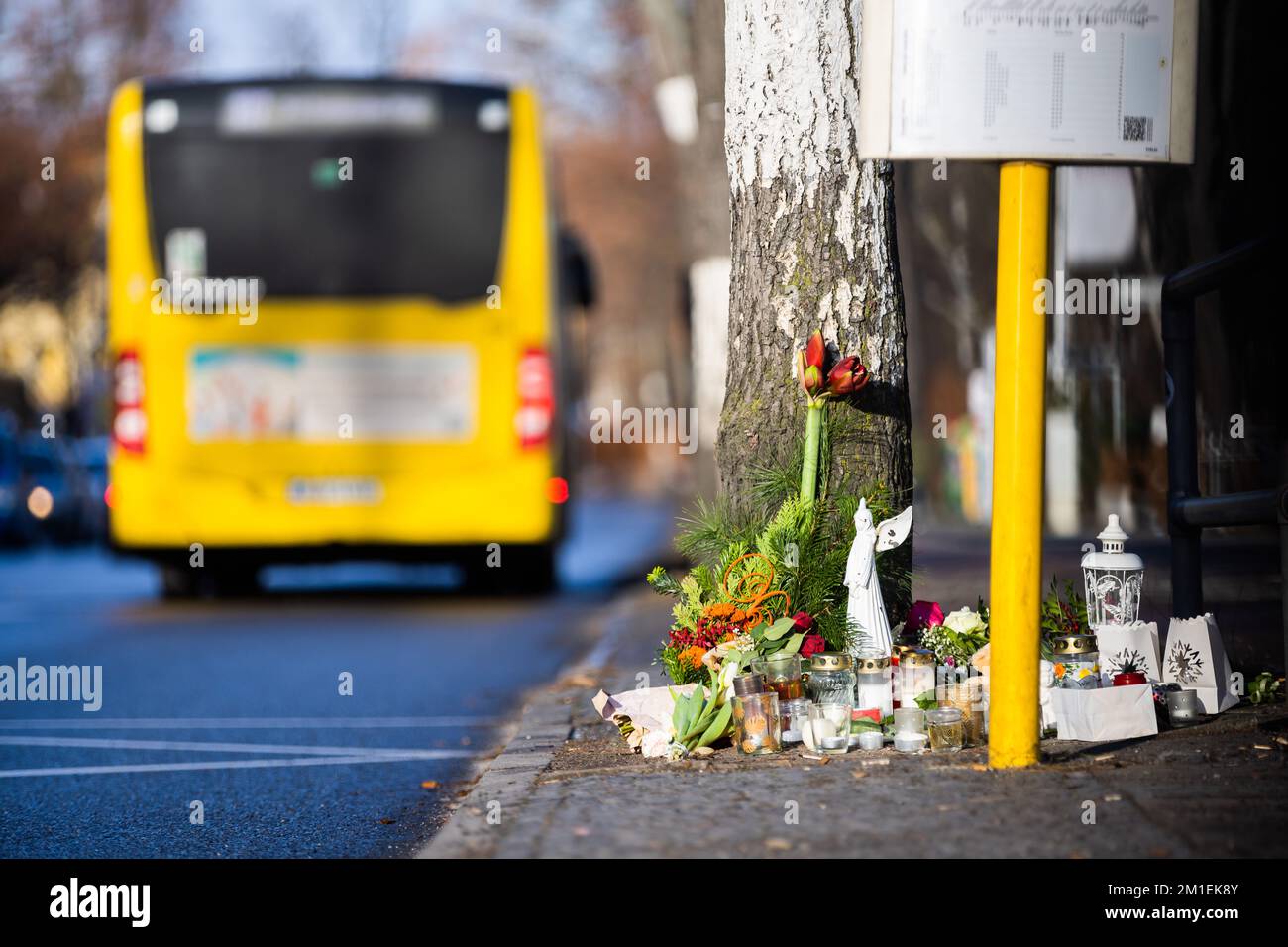 Berlin, Germany. 12th Dec, 2022. Flowers and candles lie at the ...