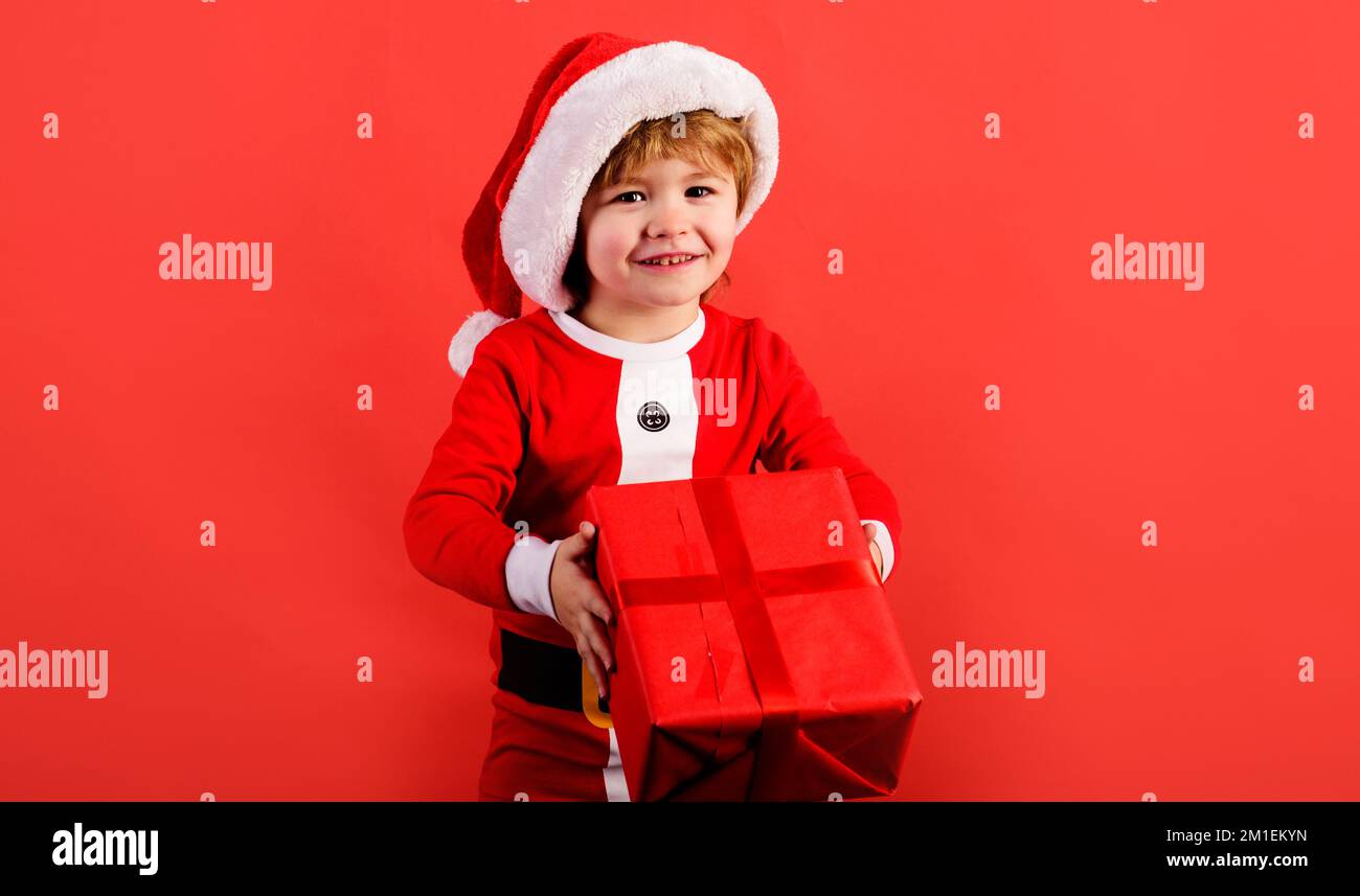 Santa helper with present gift box. Christmas child. Little kid ...