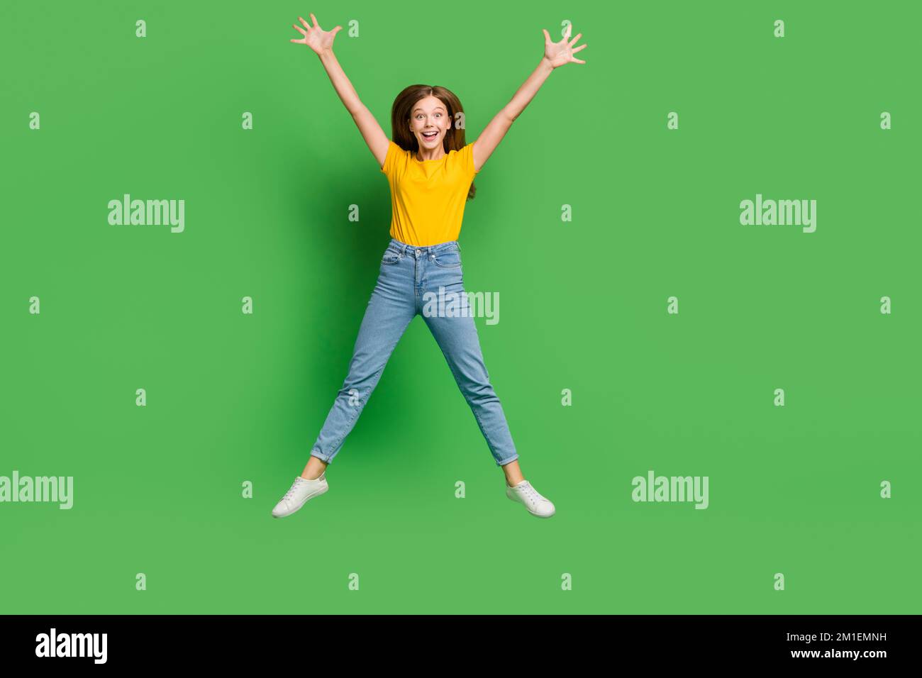 Full body portrait of active satisfied person jumping raise arms ...