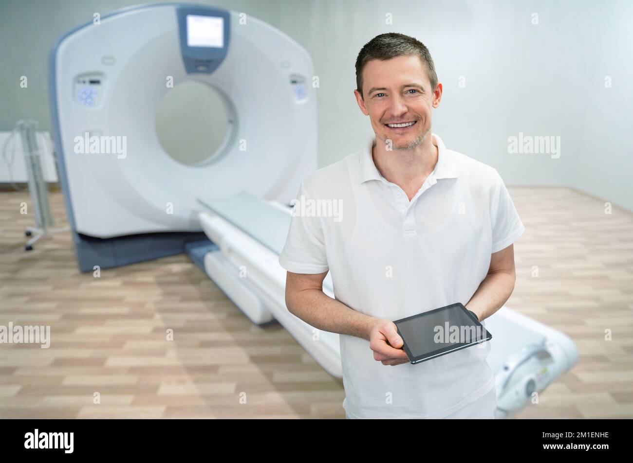Doctor with a digital tablet smiling and looking at the camera on the ...