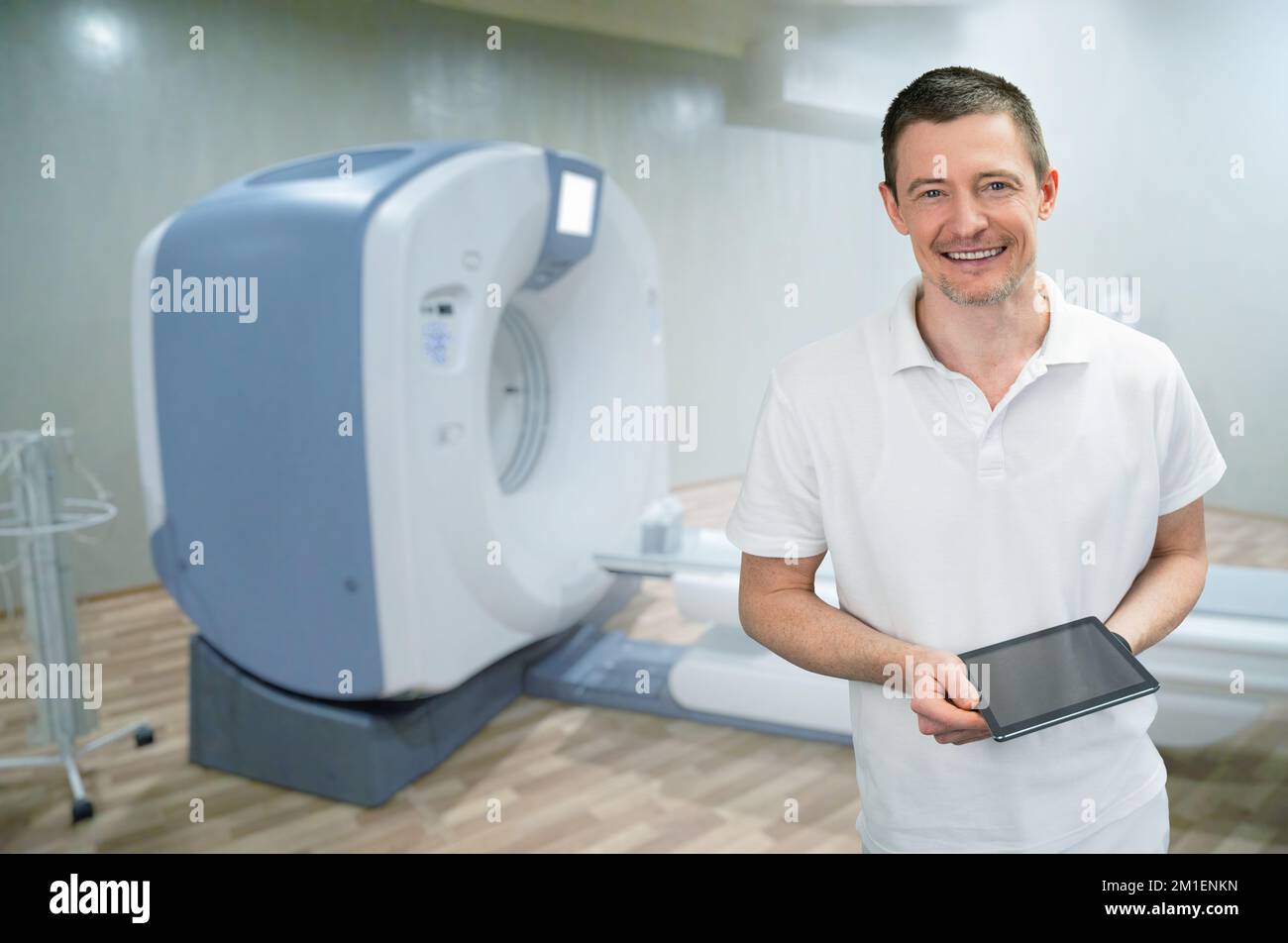 Doctor with a digital tablet smiling and looking at the camera on the ...