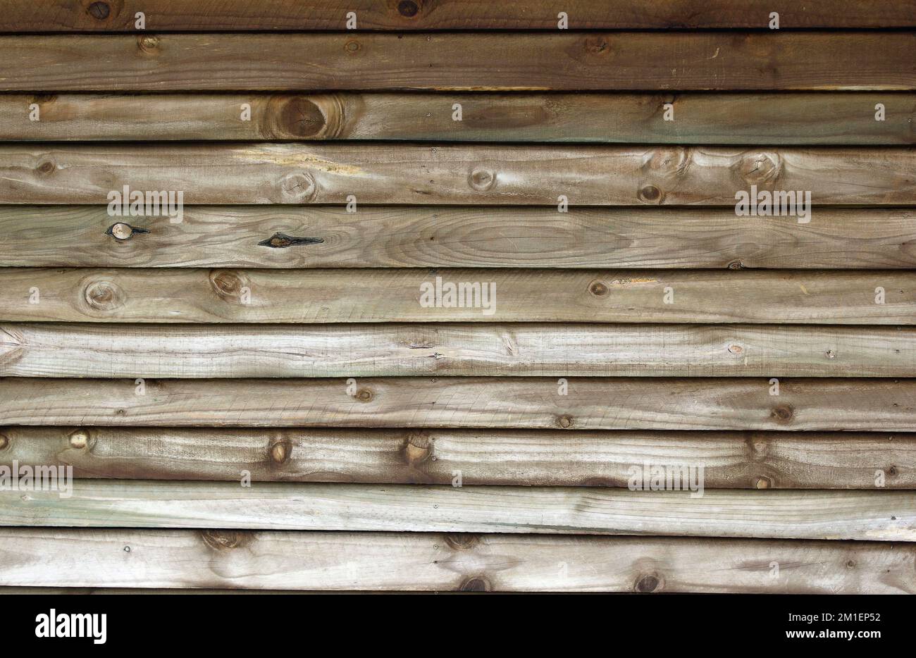 Wooden timber boards laid horizontally as part of wall, can be used as ...