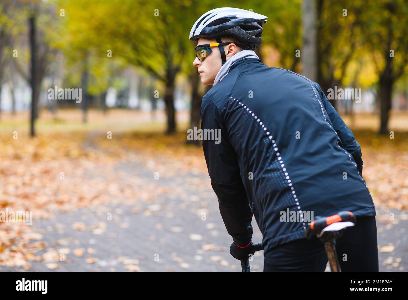 Back view of young bicyclist during ride Stock Photo - Alamy