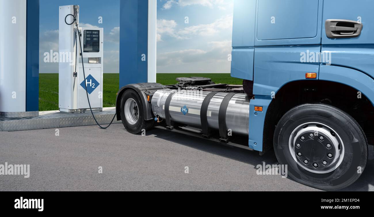 A hydrogen fuel cell semi truck with H2 gas cylinder onboard next to ...