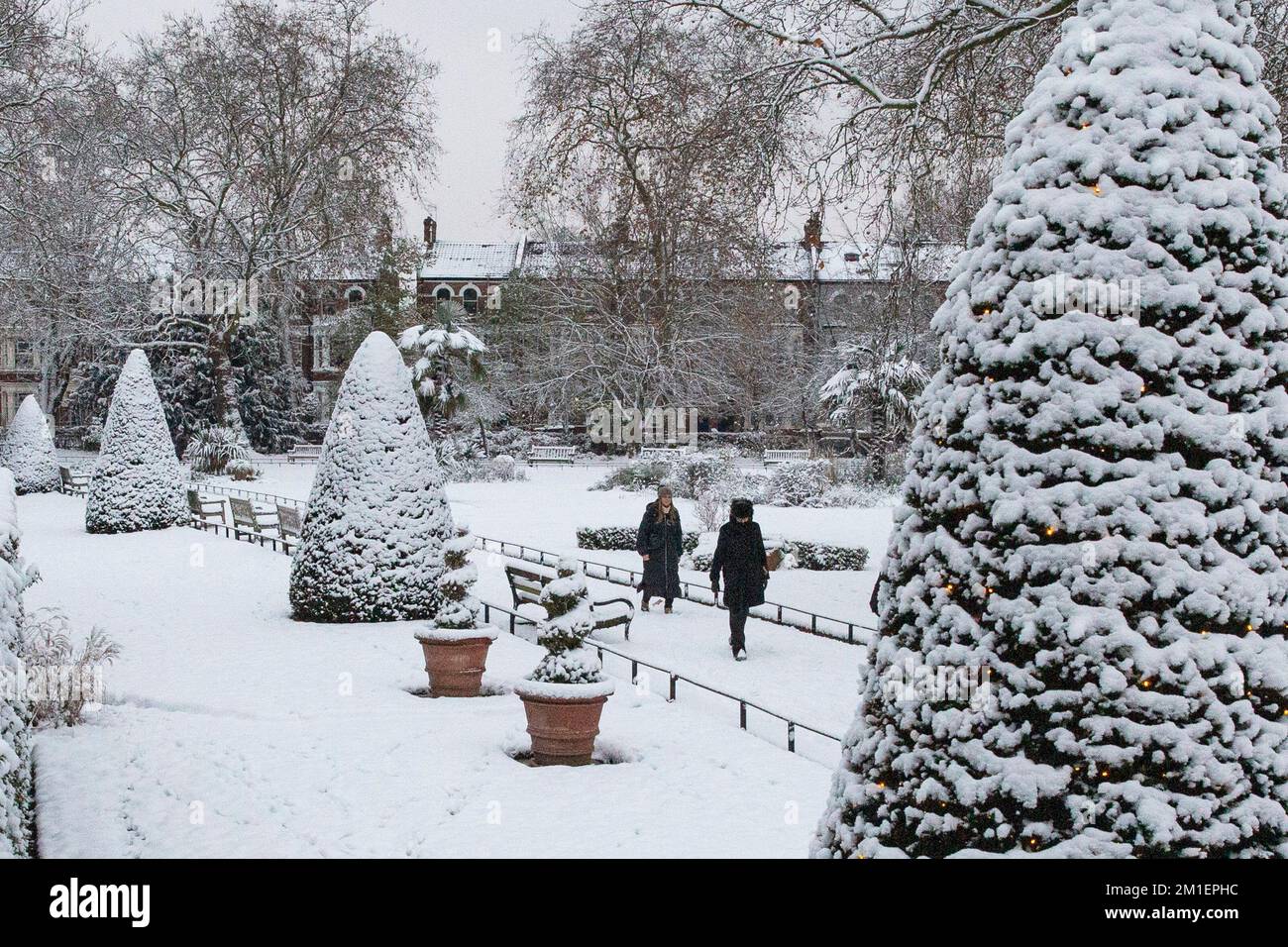 London ,United Kingdom . People walk through the thick snow in Queens ...