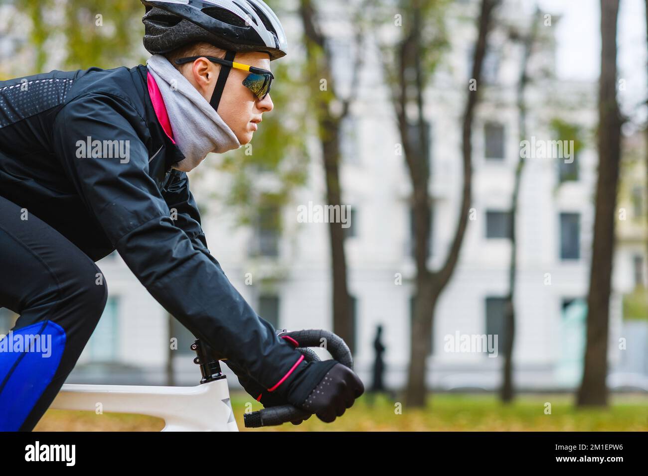 Young bicyclist in helmet during motion ride Stock Photo - Alamy