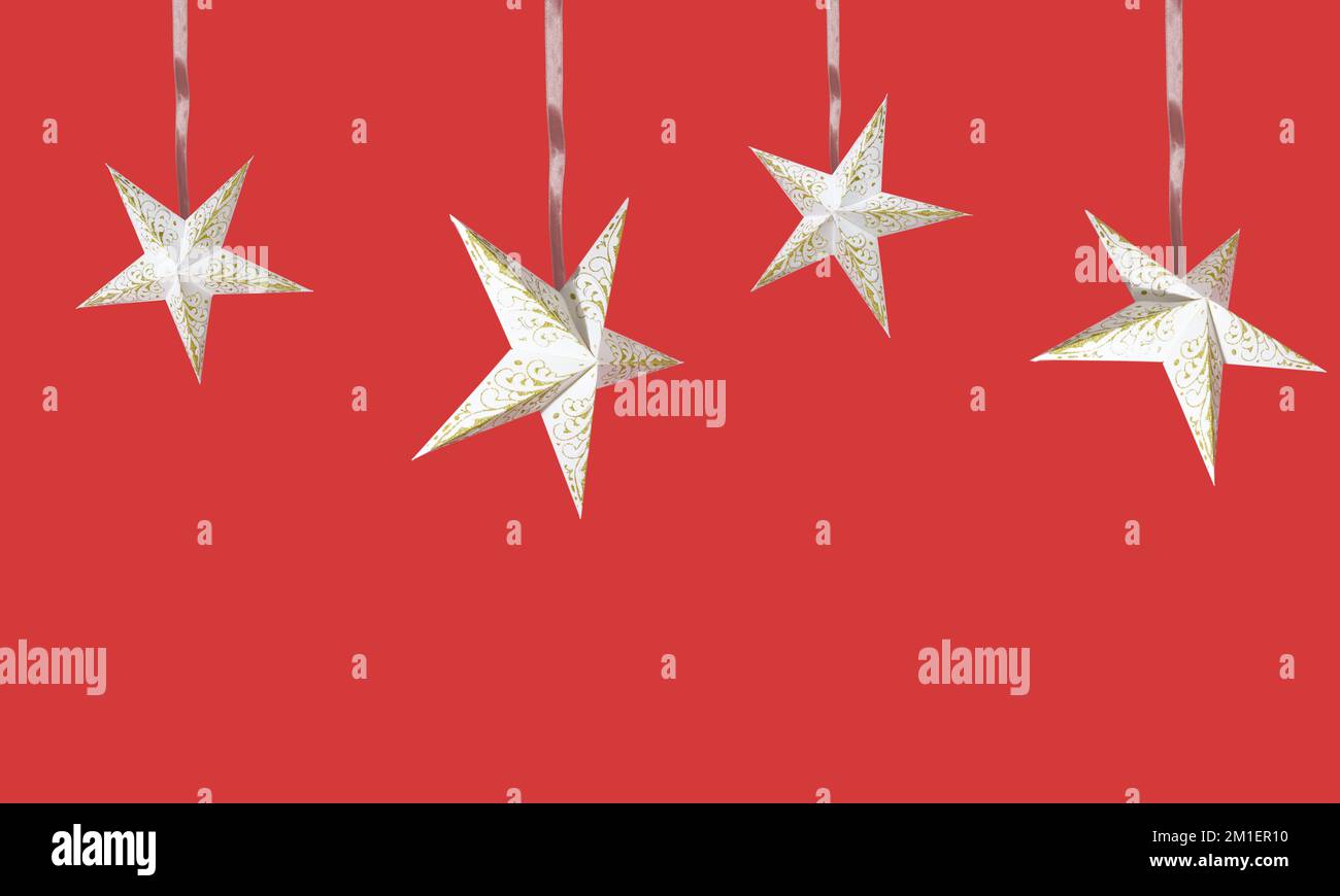 stars decorations hanging on red background, creative holiday concept ...