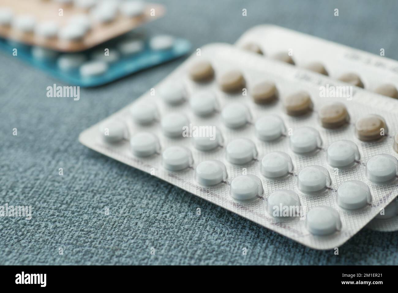 birth control pills on wooden background, close up Stock Photo - Alamy