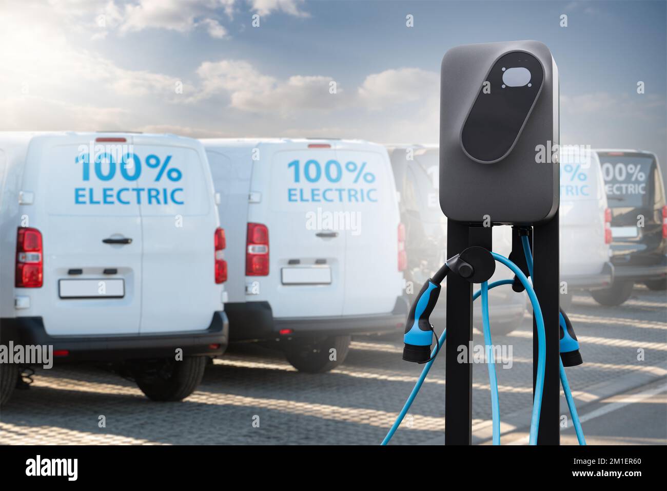 Electric vehicles charging station on a background of a van. Concept ...