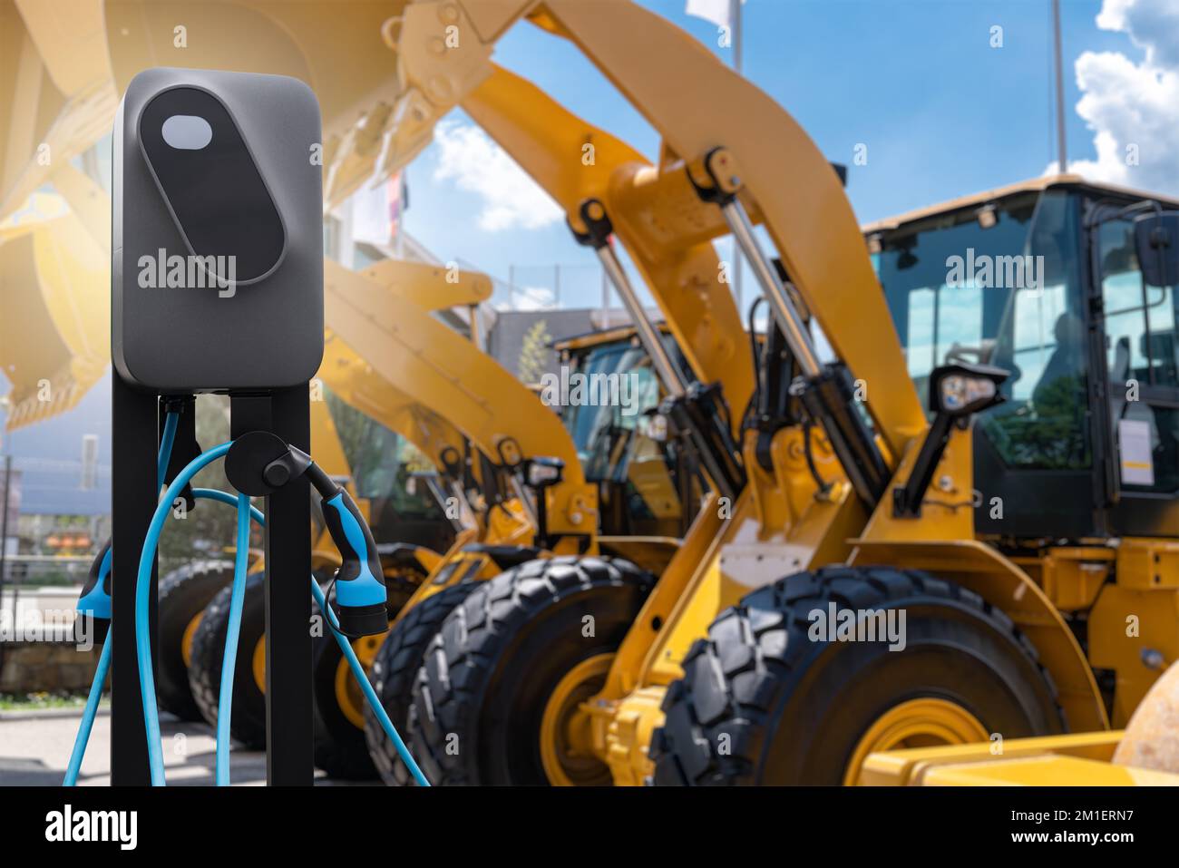 Electric construction machines with charging station. Concept Stock ...
