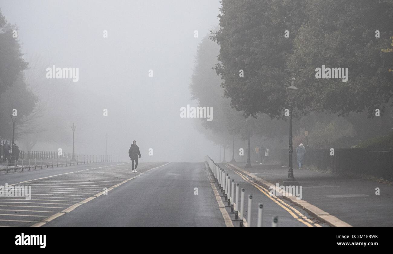 People navigate thick fog in Dublin City as the Irish Met office issued ...