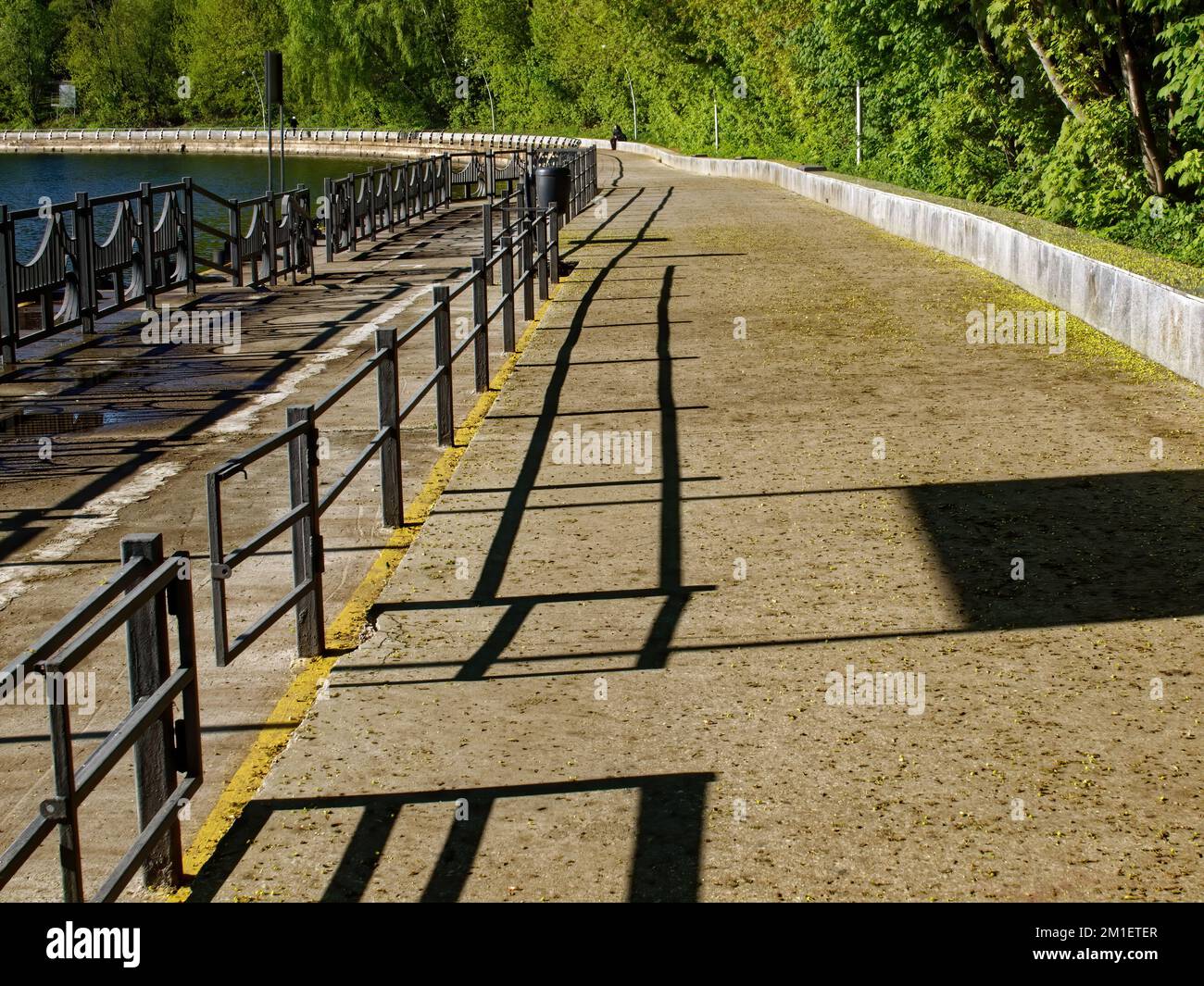 river embankment made of concrete slabs on a clear day, in summer Stock ...