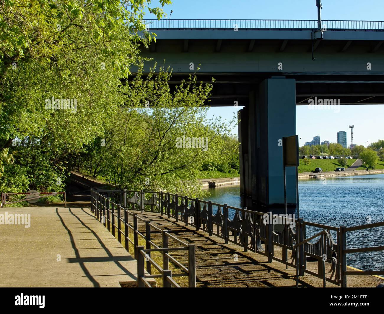 river embankment made of concrete slabs on a clear day, in summer Stock ...