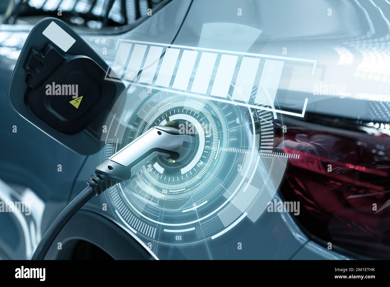 Close up of electric car inlet with connected charging cable and ...