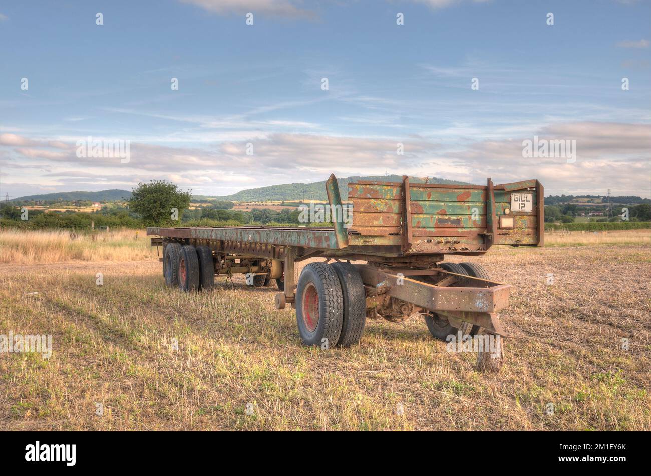 Old farm trailer in a field Stock Photo - Alamy