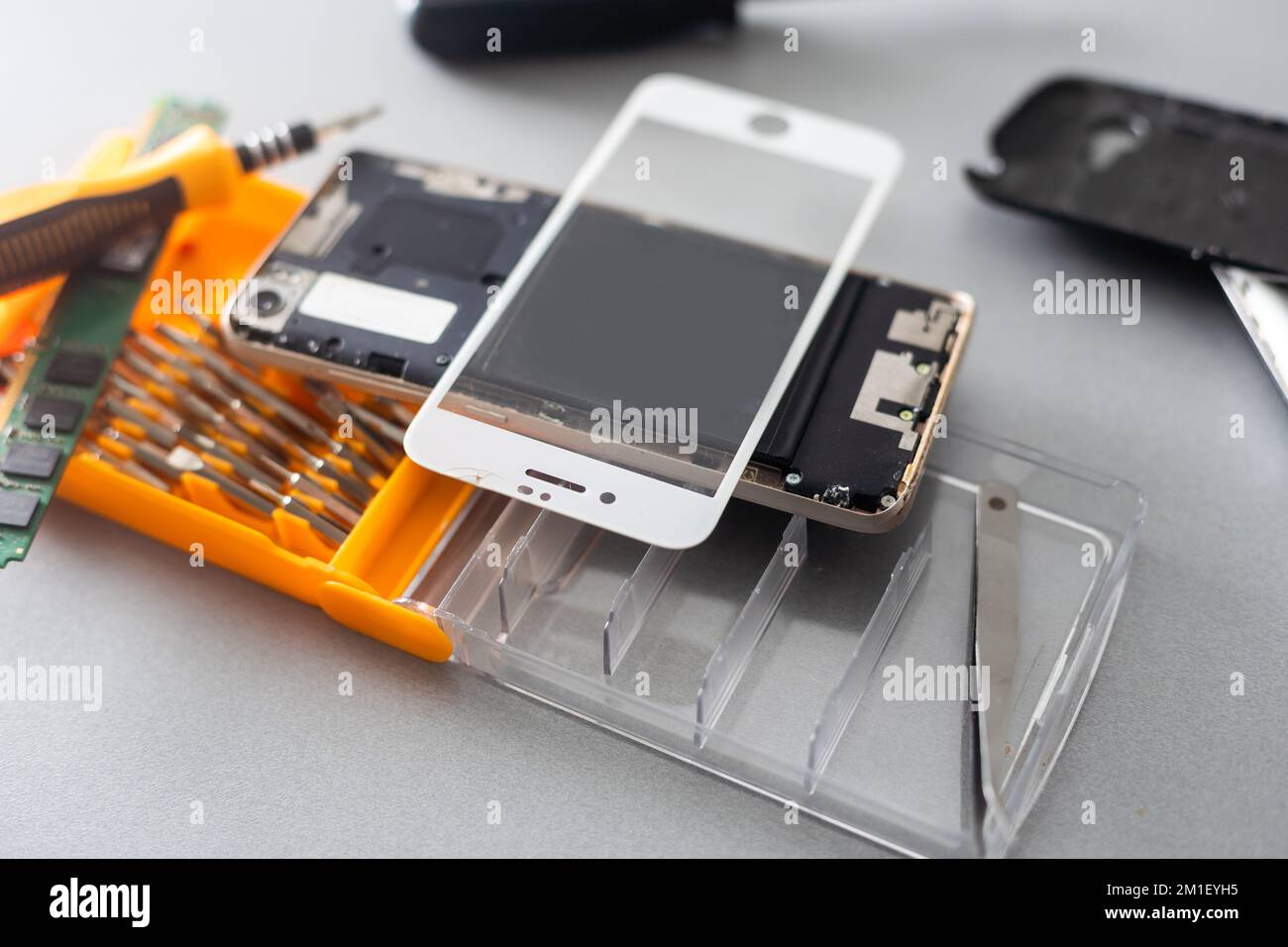 The technician repairing the smartphone's motherboard in the lab with ...