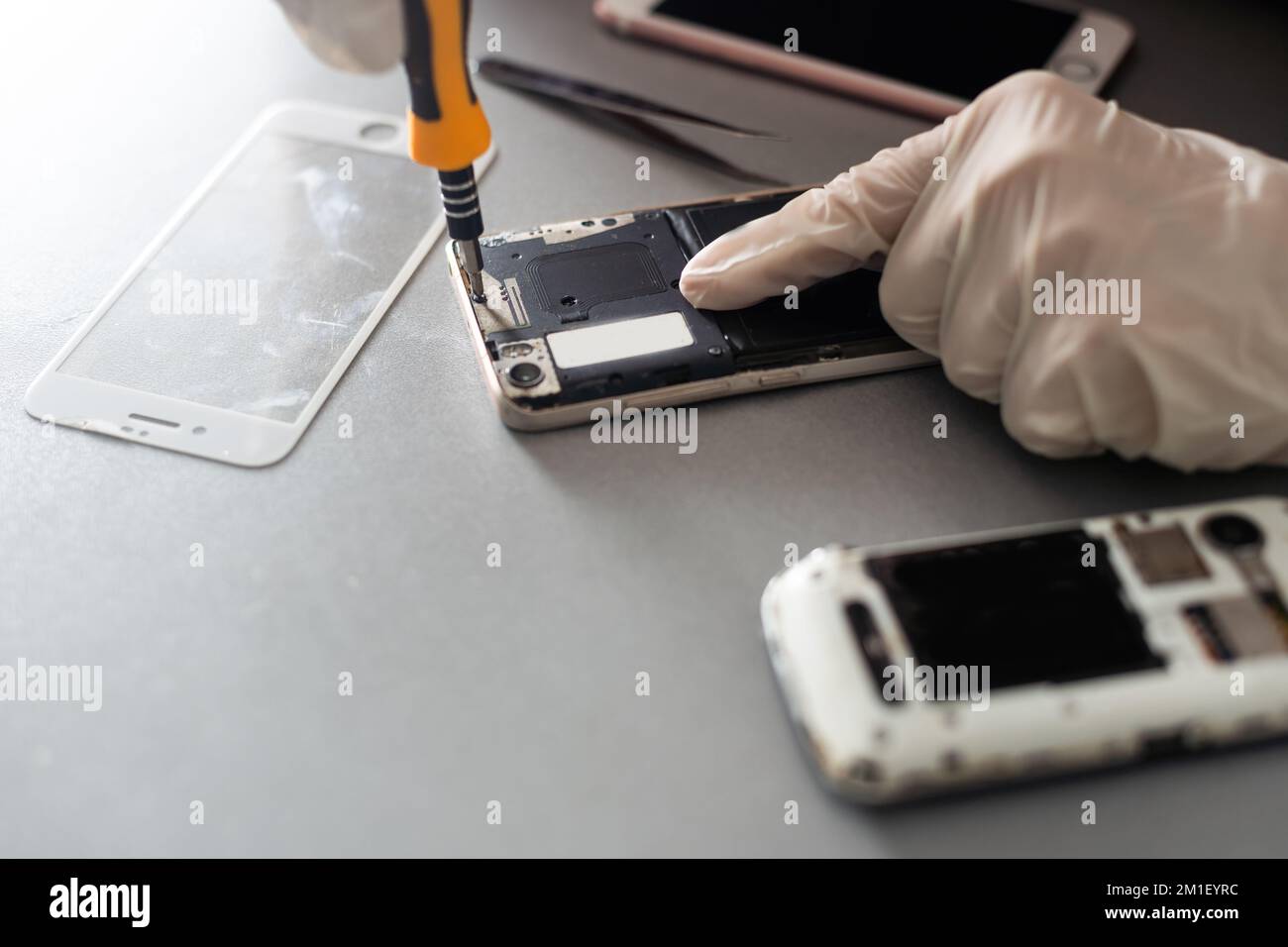 Close-up photos showing process of mobile phone repair Stock Photo - Alamy