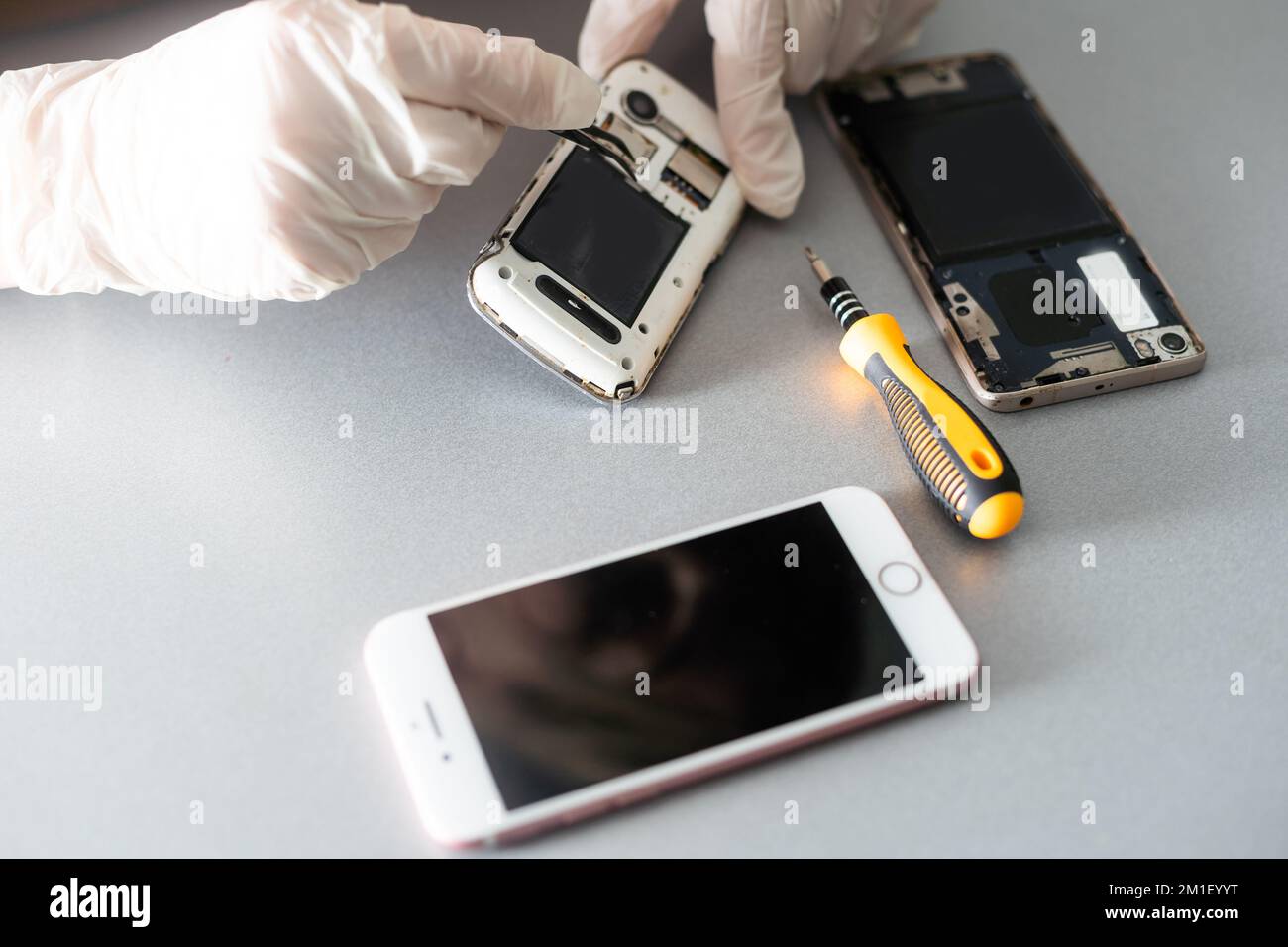 Technician prepairing to repair and replace new screen broken and ...