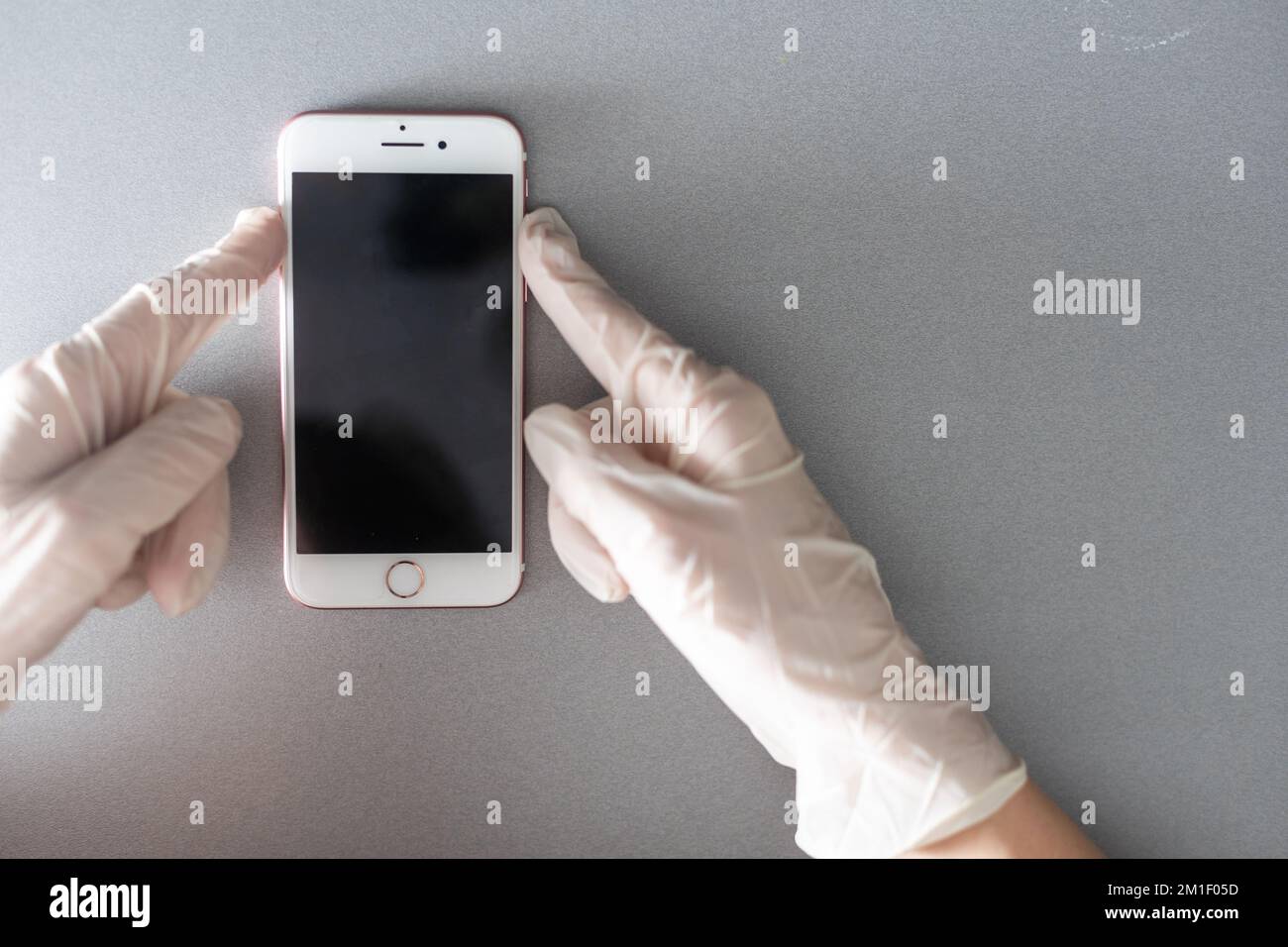 hands diagnosing smartphone buttons - phone repair and check up concept ...